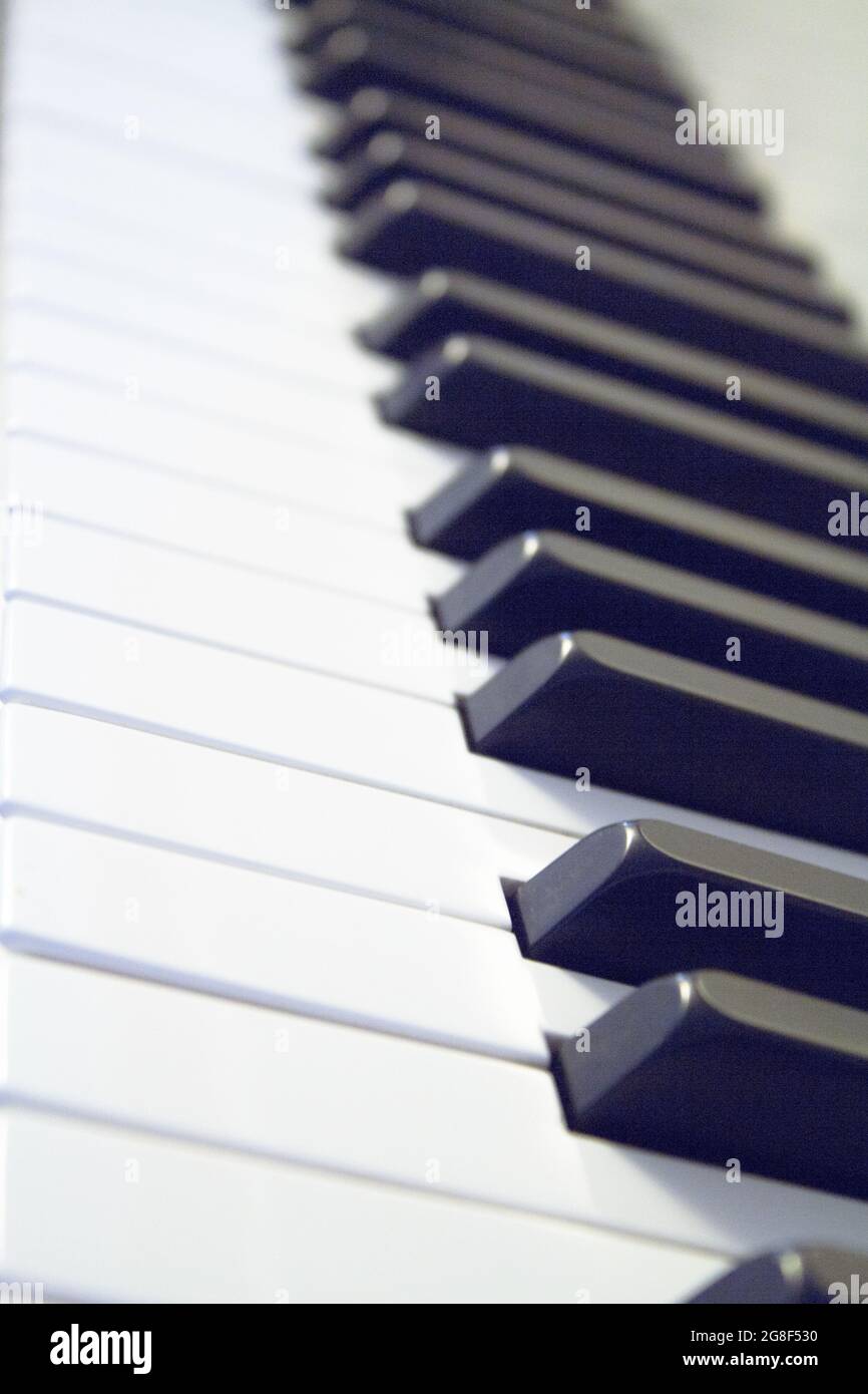 Part of the keyboard of a piano in white color. No people Stock Photo ...
