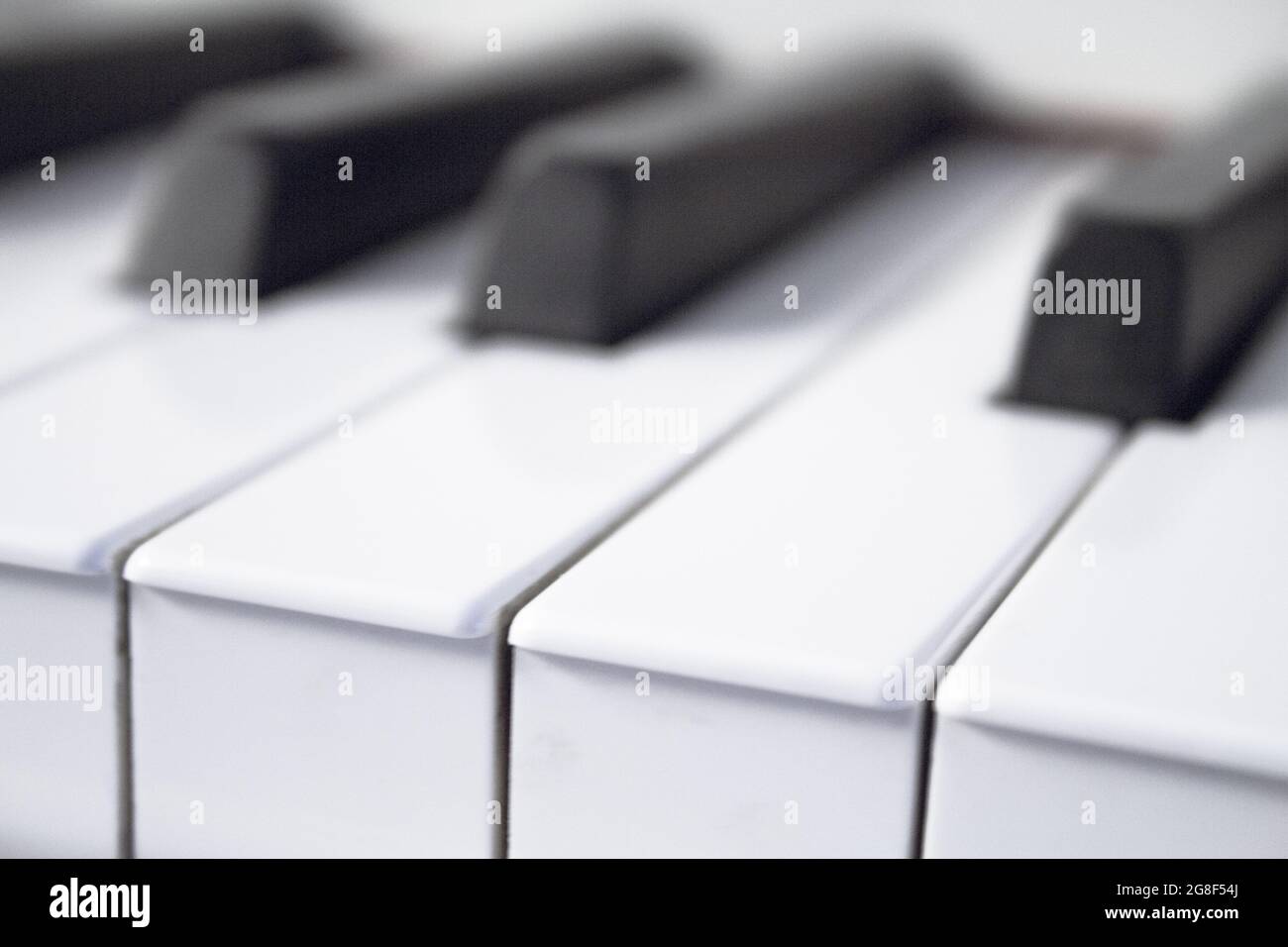 Part of the keyboard of a piano in white color. No people Stock Photo ...