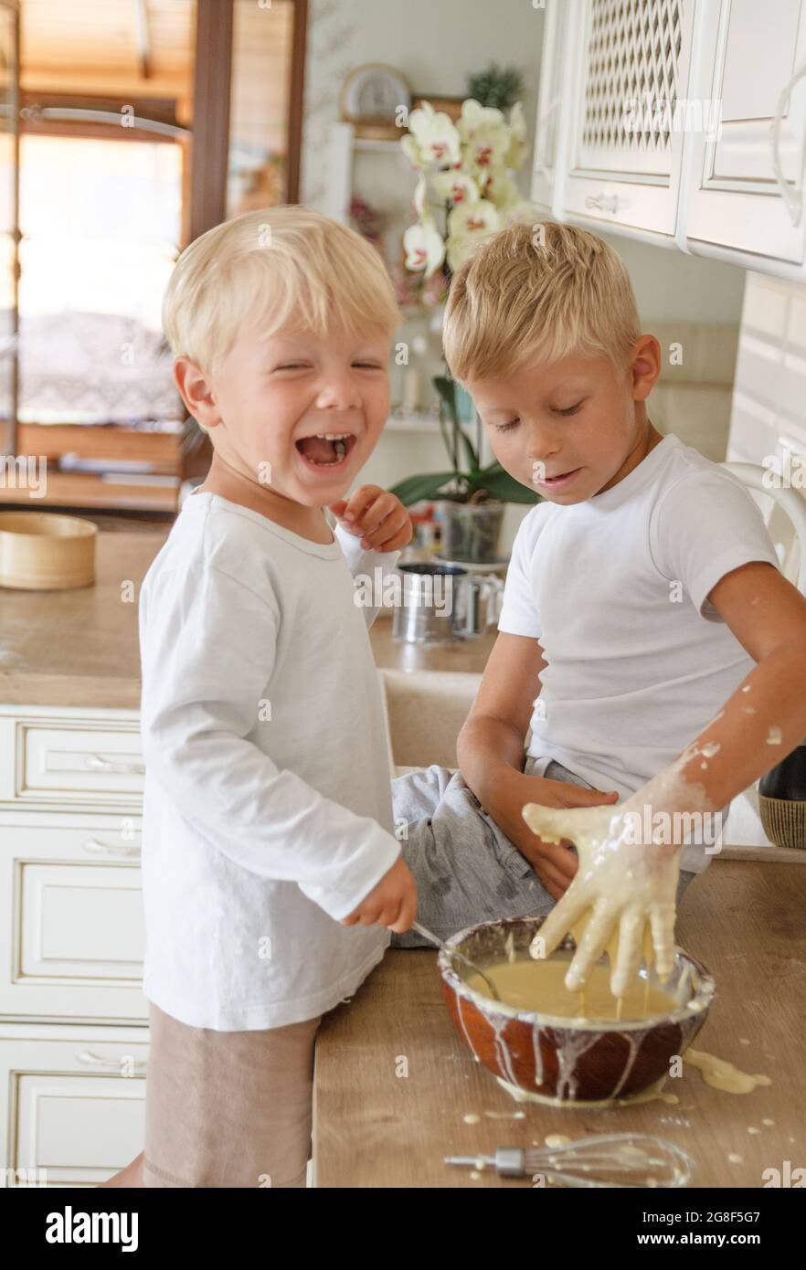 Boys preeparing bake homemade pie in kitchen. Two brothers cooki Stock ...