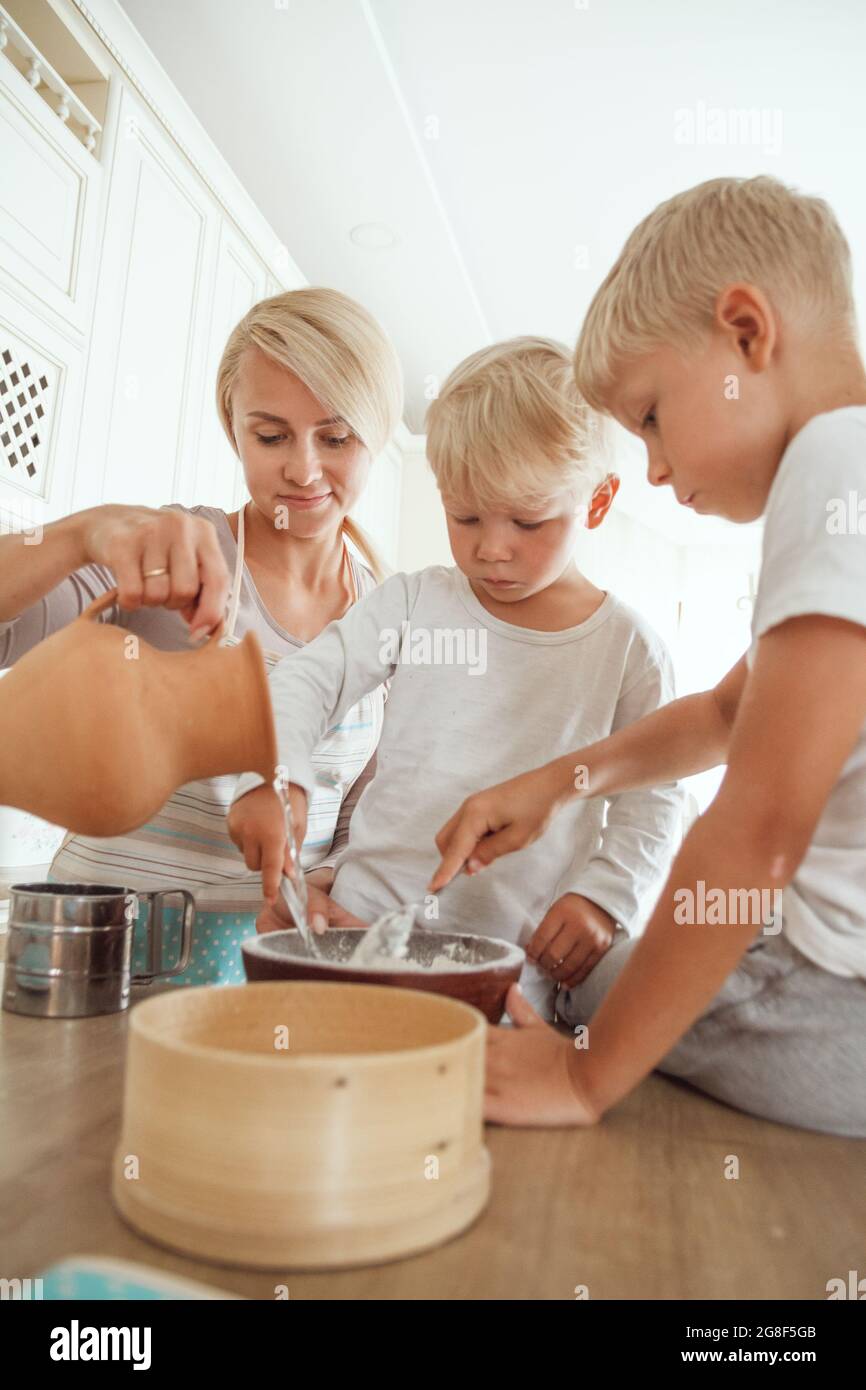 Boy making cake parent hi-res stock photography and images - Alamy