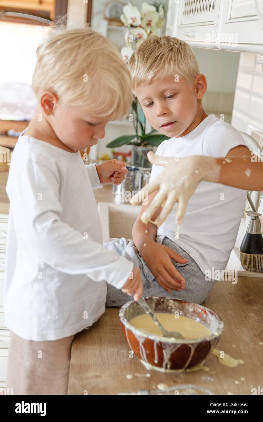 Boys preeparing bake homemade pie in kitchen. Two brothers cooki Stock ...