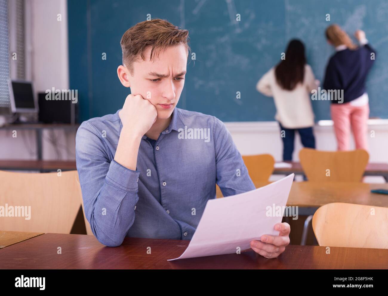 Upset teen student looking at failed exam Stock Photo - Alamy
