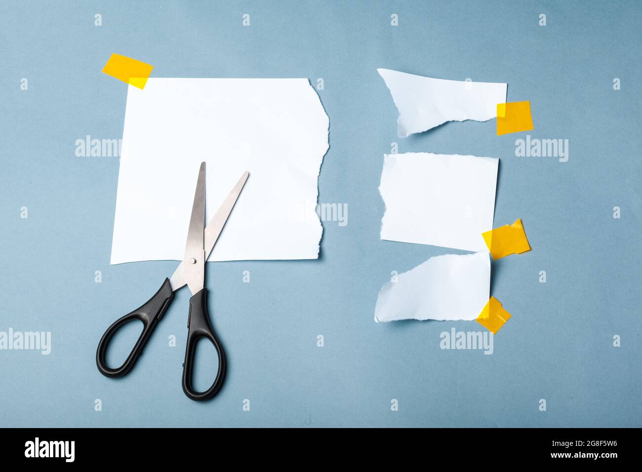 Pieces of paper and adhesive tape on paper background Stock Photo - Alamy