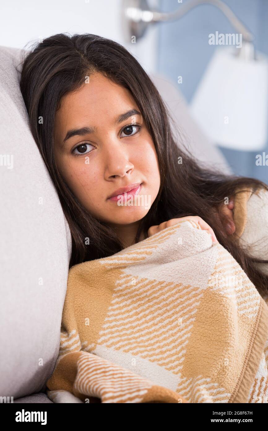 Young woman lying and melancholy Stock Photo - Alamy