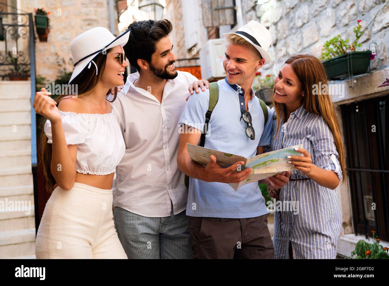 Travel, vacation and friendship concept. Group of smiling friends with ...