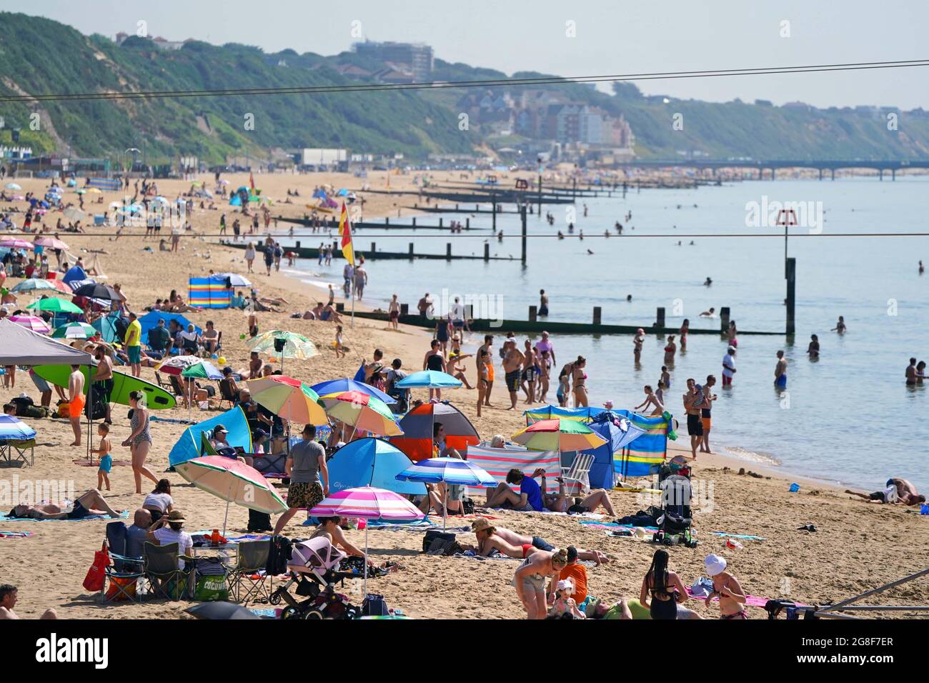 People enjoy the weather on Bournemouth beach in Dorset. Temperatures ...