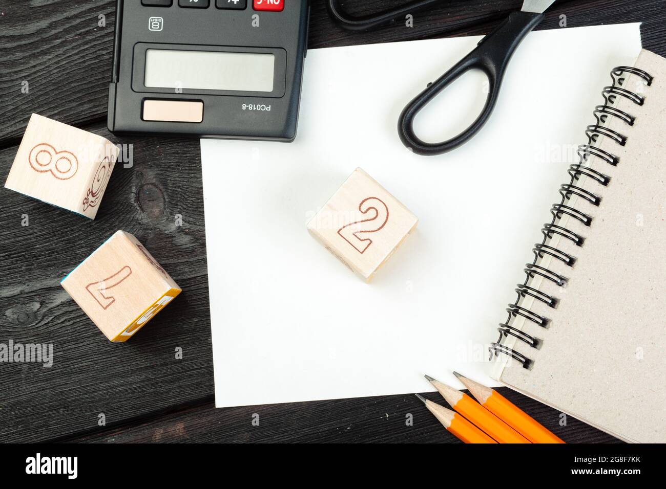 Wooden cubes with numbers on tabletop close up. Education concept Stock ...