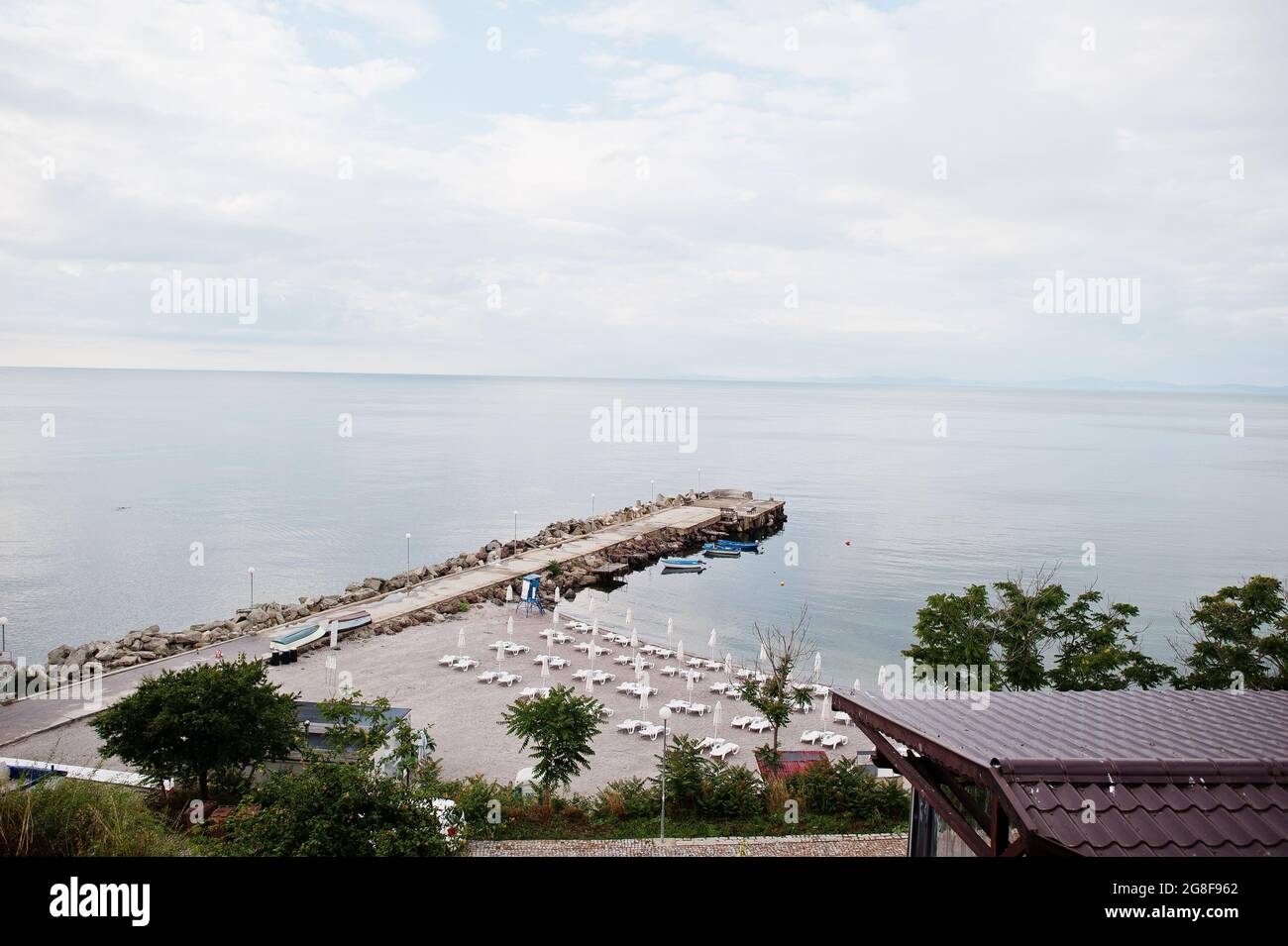 View of pier with sunbeds in the old town of Nesebar, Bulgaria Stock ...