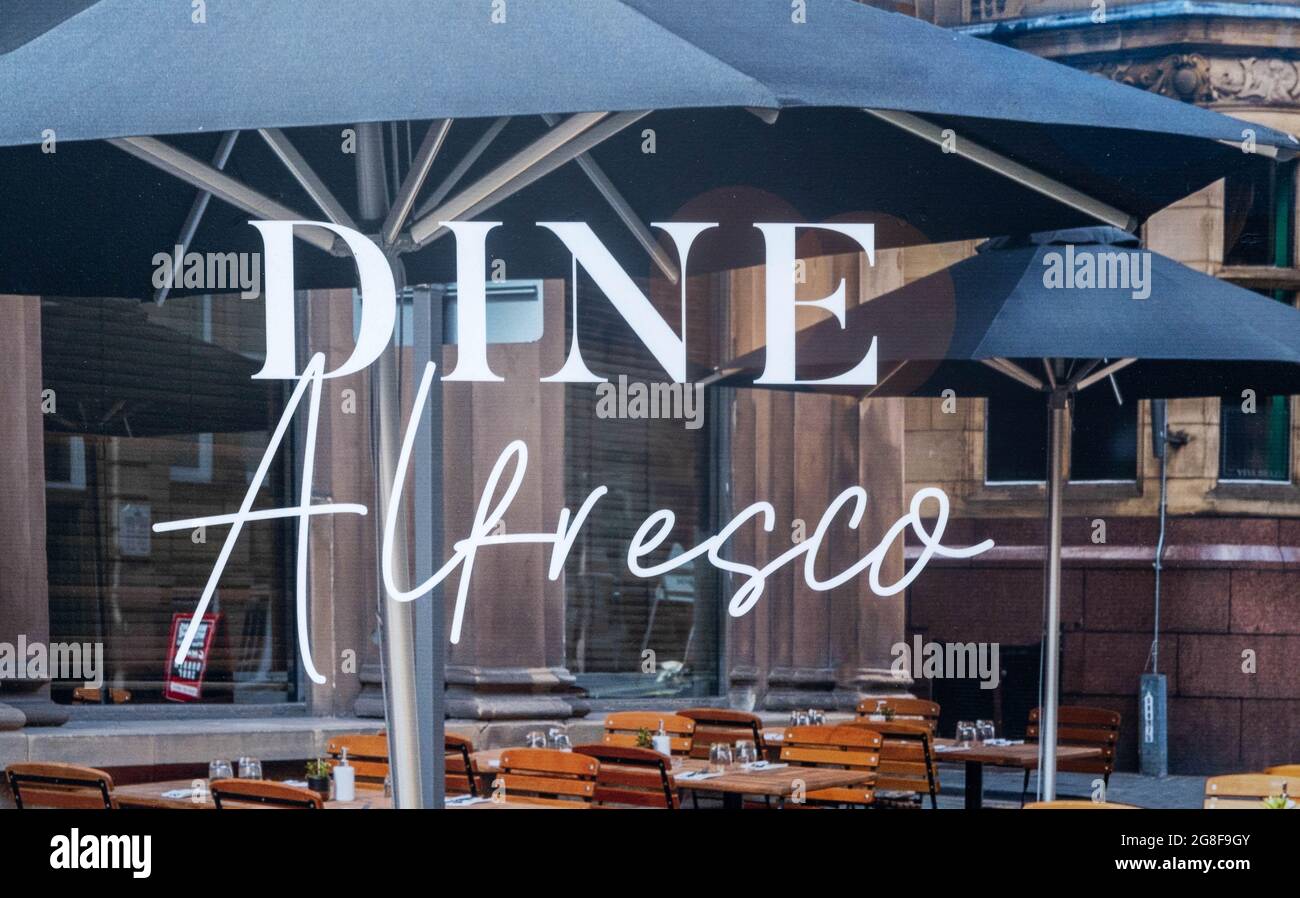 Invitation sign to dine alfresco in Liverpool Stock Photo - Alamy
