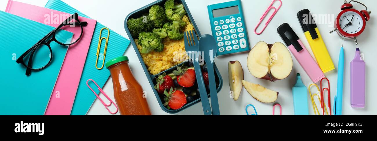 Study concept with lunch box on white background Stock Photo - Alamy