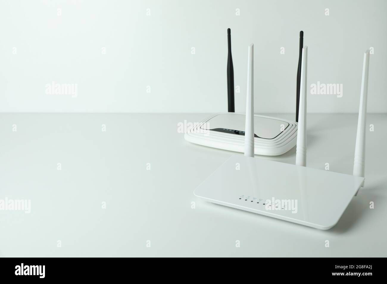 Wi-Fi routers with external antennas on white background Stock Photo ...
