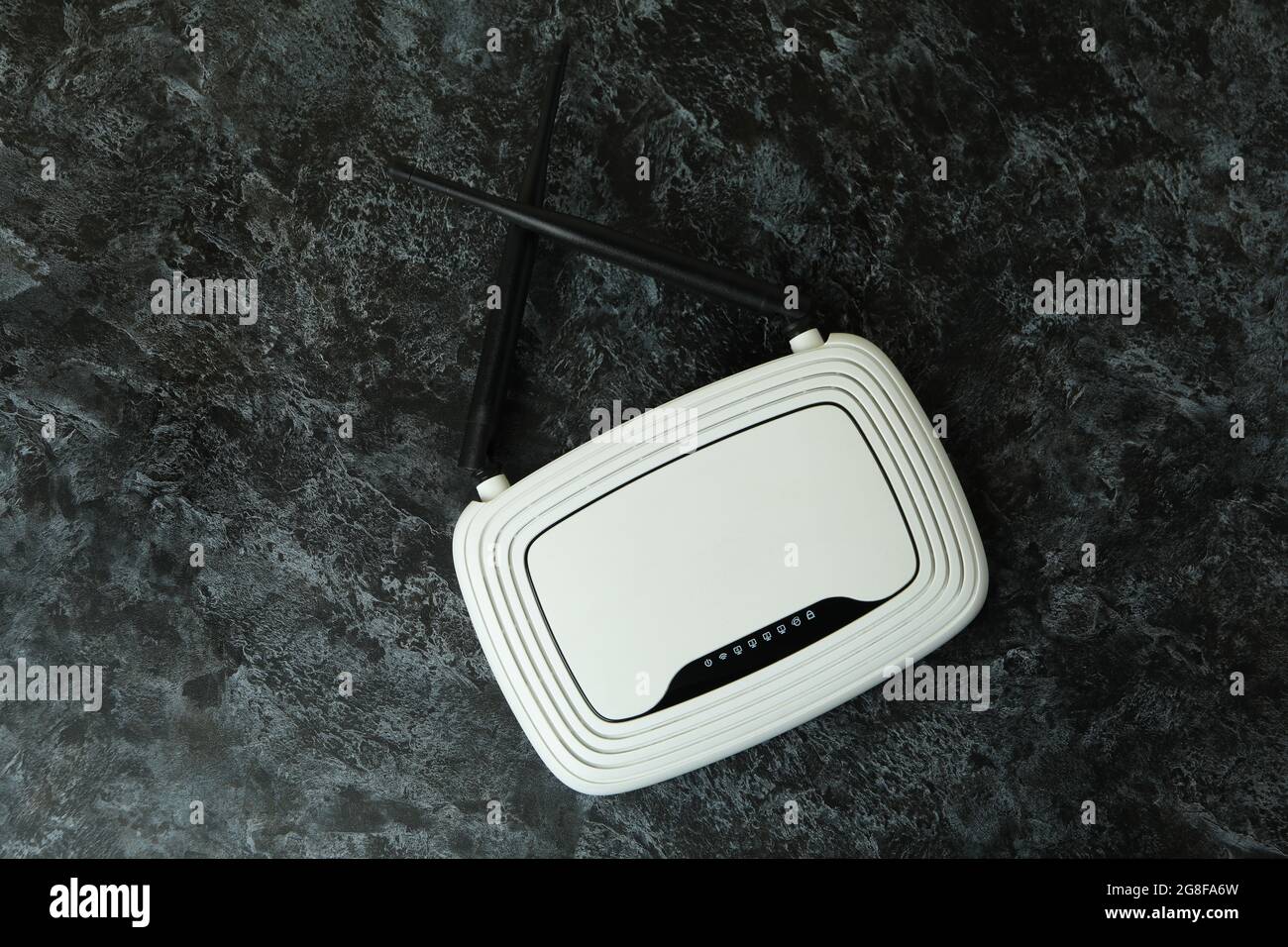 Wi-Fi router with external antennas on black smokey background Stock ...