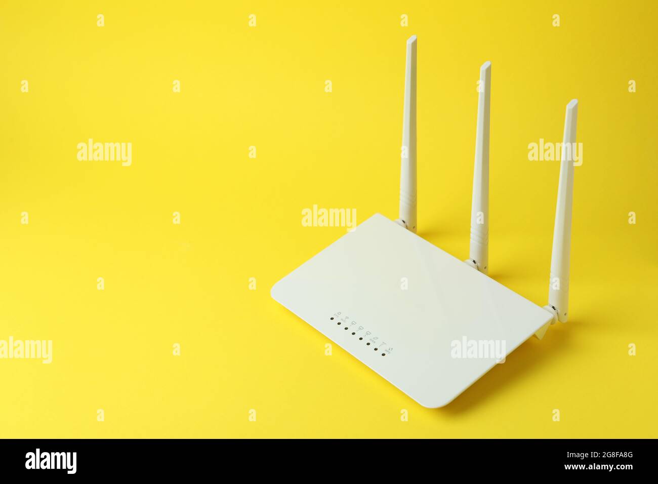Wi-Fi router with external antennas on yellow background Stock Photo ...