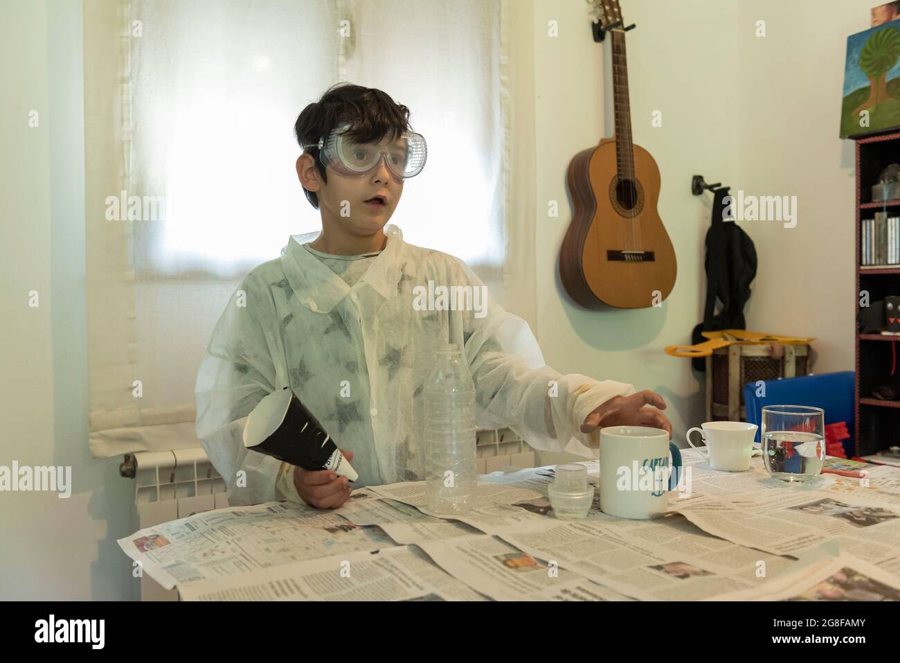 kid play science experiment at home lab with glasses and secure wear ...