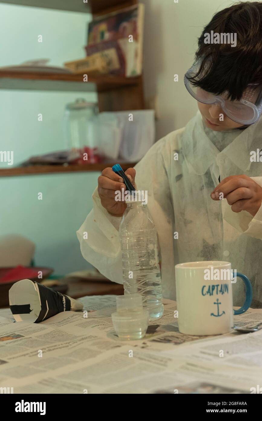 kid play science experiment chemical game indoor at home table with ...