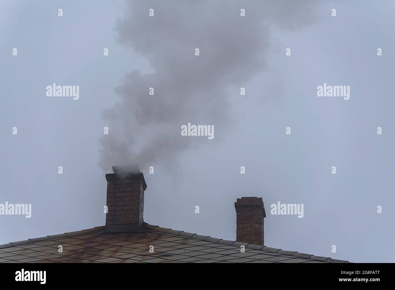 Photo of a smoking chimney. Air pollution Stock Photo - Alamy
