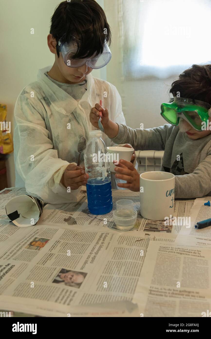 two kid play science experiment chemical game indoor at home lab Stock ...