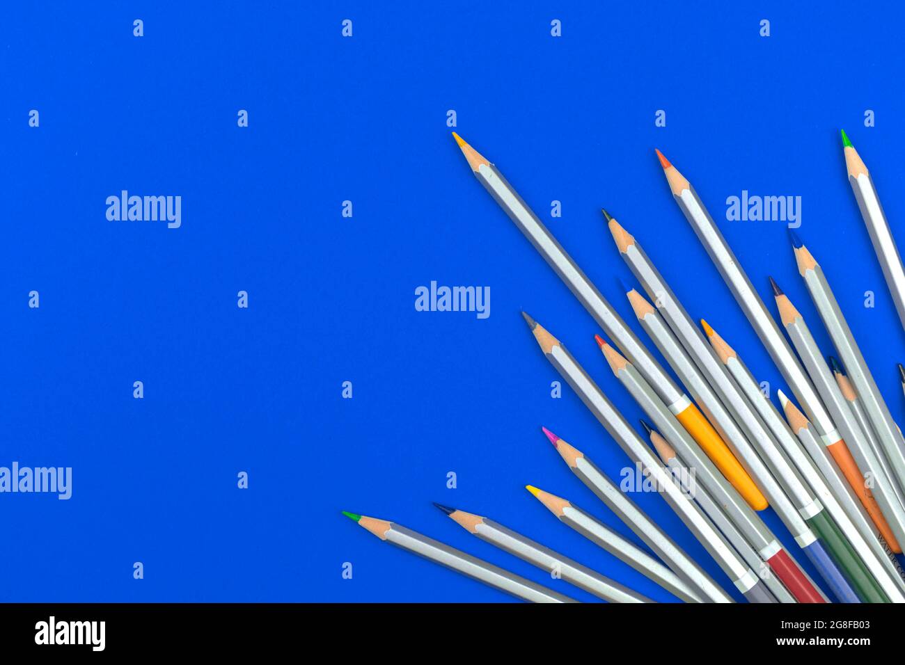 Set of simple school color pencils. Blue office table with school ...
