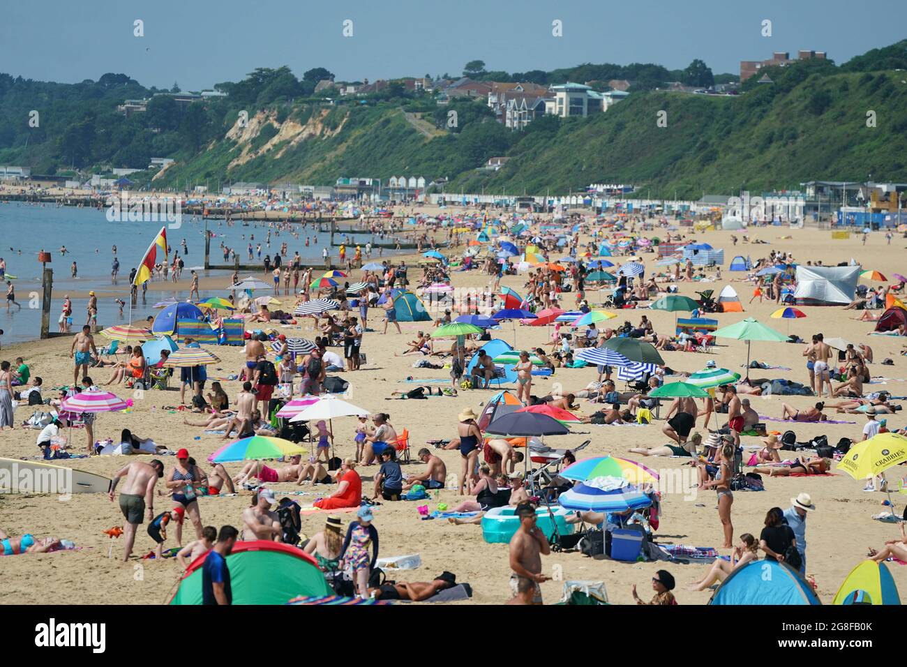 People enjoy the weather on Bournemouth beach in Dorset. Temperatures ...