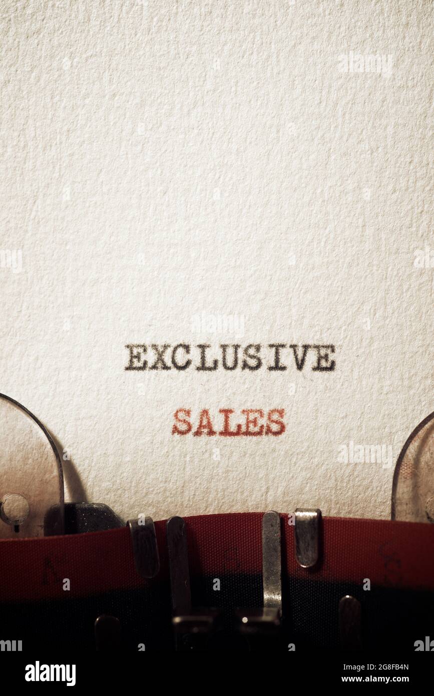 Exclusive sales phrase written with a typewriter Stock Photo - Alamy
