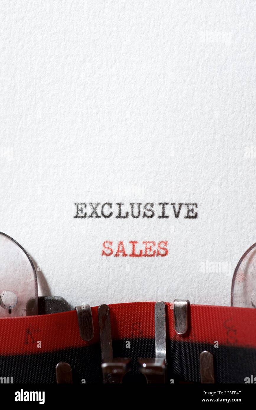 Exclusive sales phrase written with a typewriter Stock Photo - Alamy