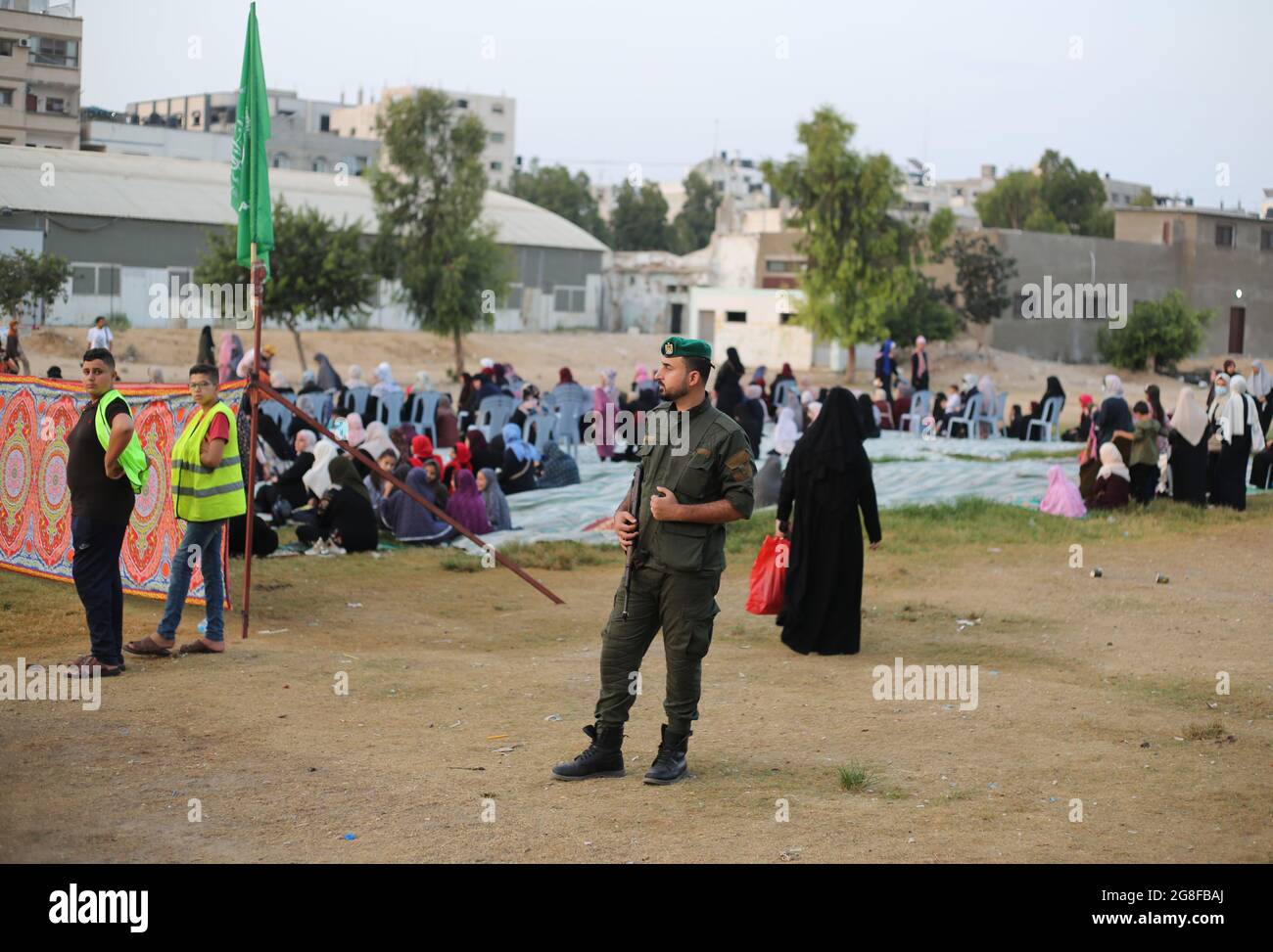 A security guard stands on guard at Al-Saraya mosque on the first day ...