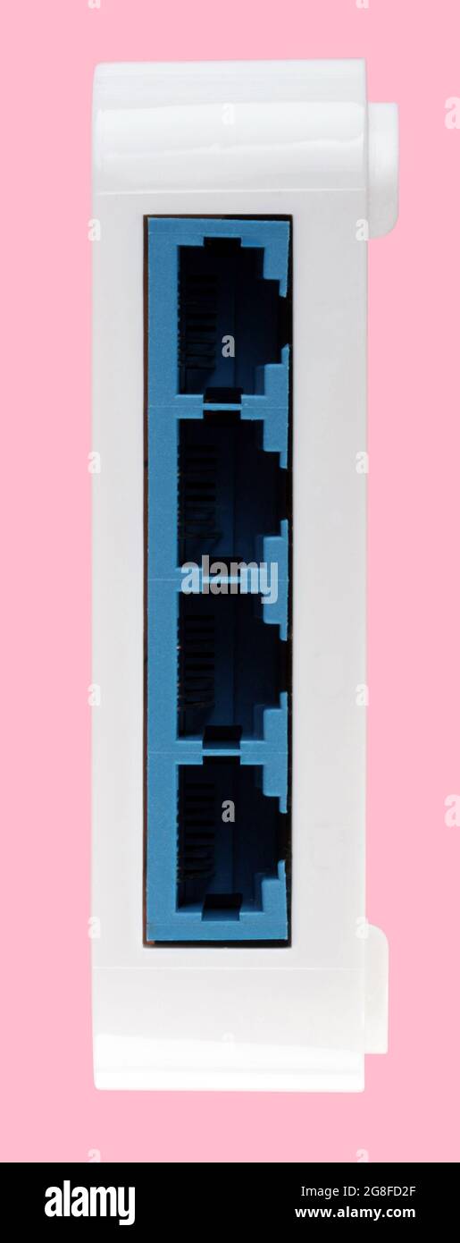White 8 Port Plastic Ethernet Switch isolated on pink background at dry ...