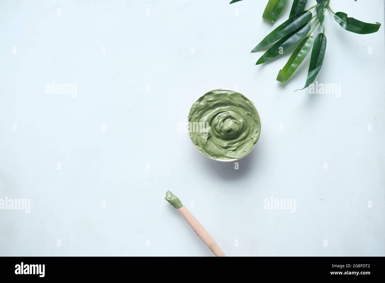 bubble clay mask in container on white background Stock Photo - Alamy