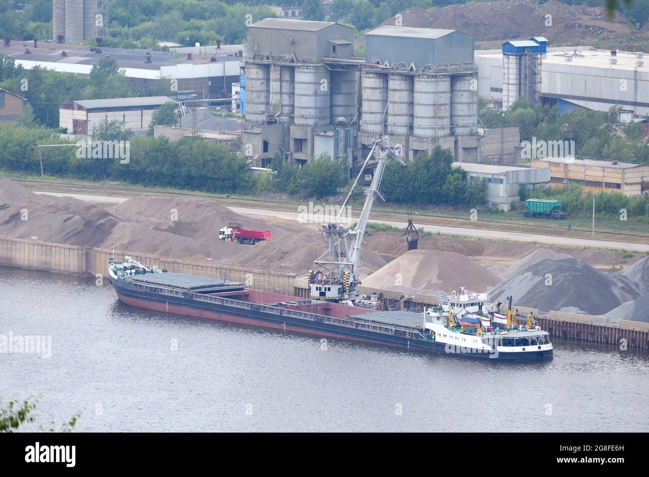 Barge on the river Unloading river sand from a barge Navigable river ...