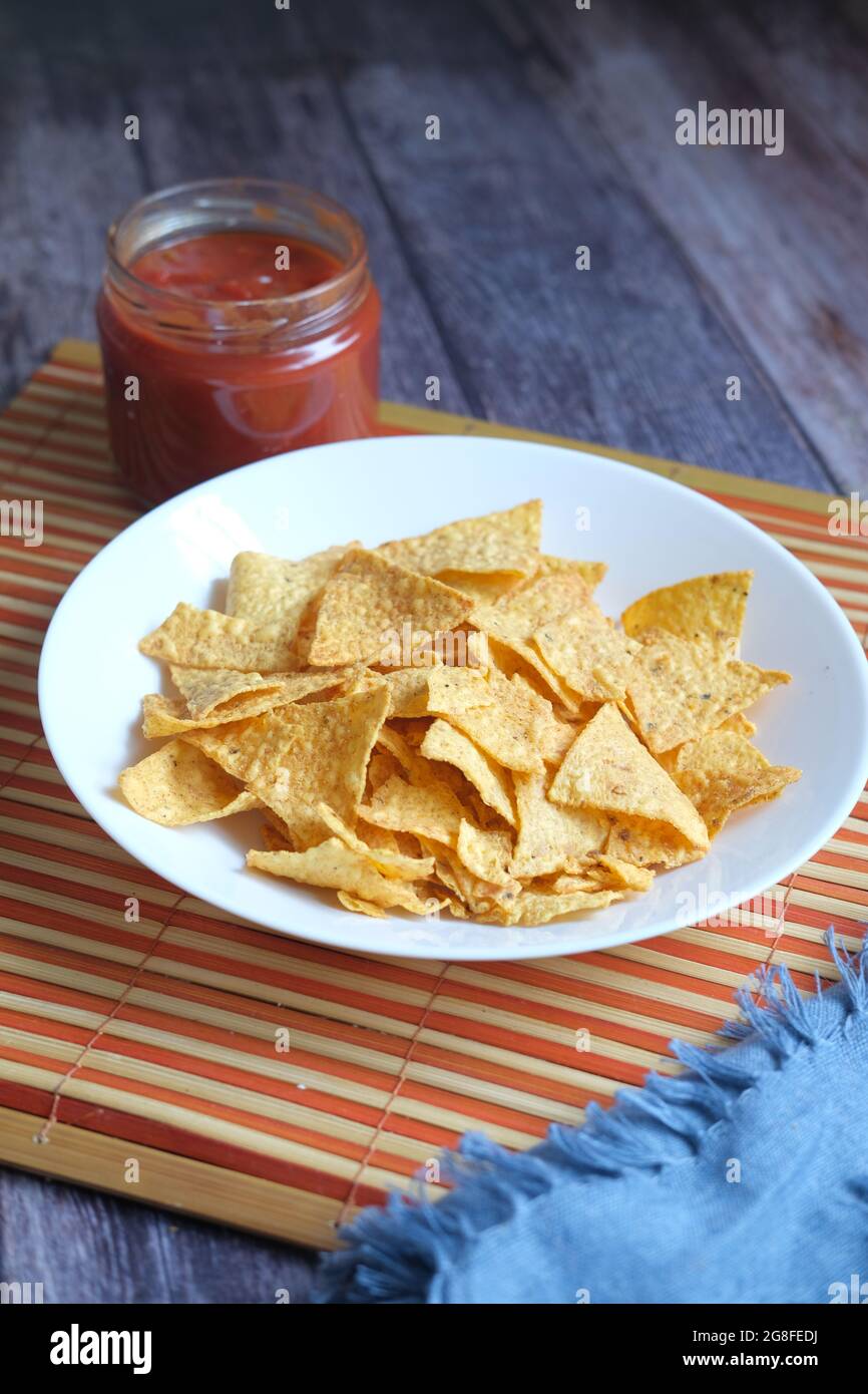 a bowl of chips and salsa on table Stock Photo - Alamy