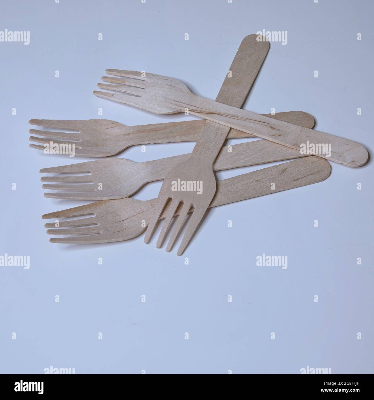 Wooden Forks. Isolated. Copy Space. Five small wooden forks on a white ...