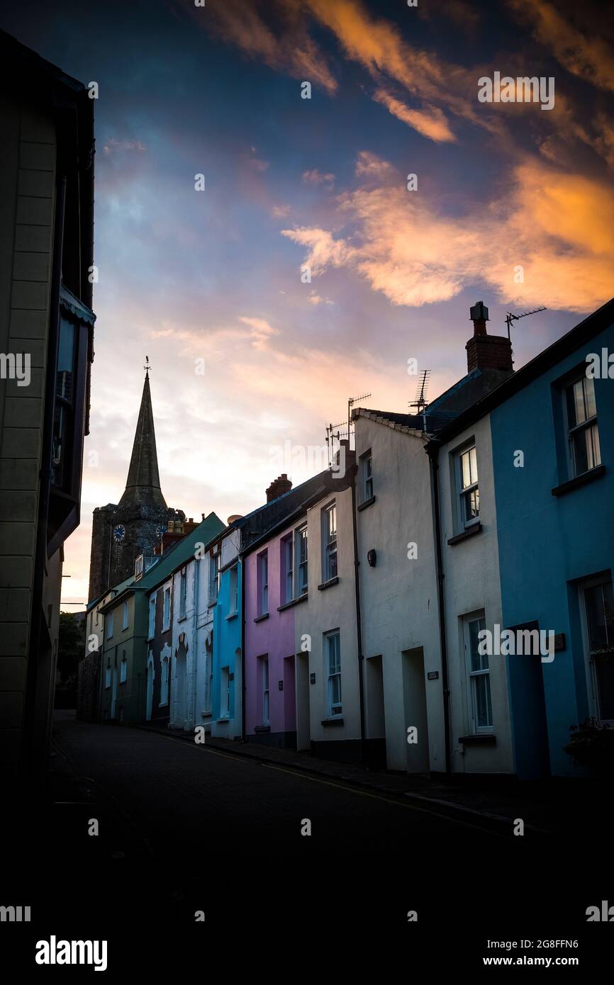 Tenby street and spire at dusk in Pembrokeshire Stock Photo - Alamy