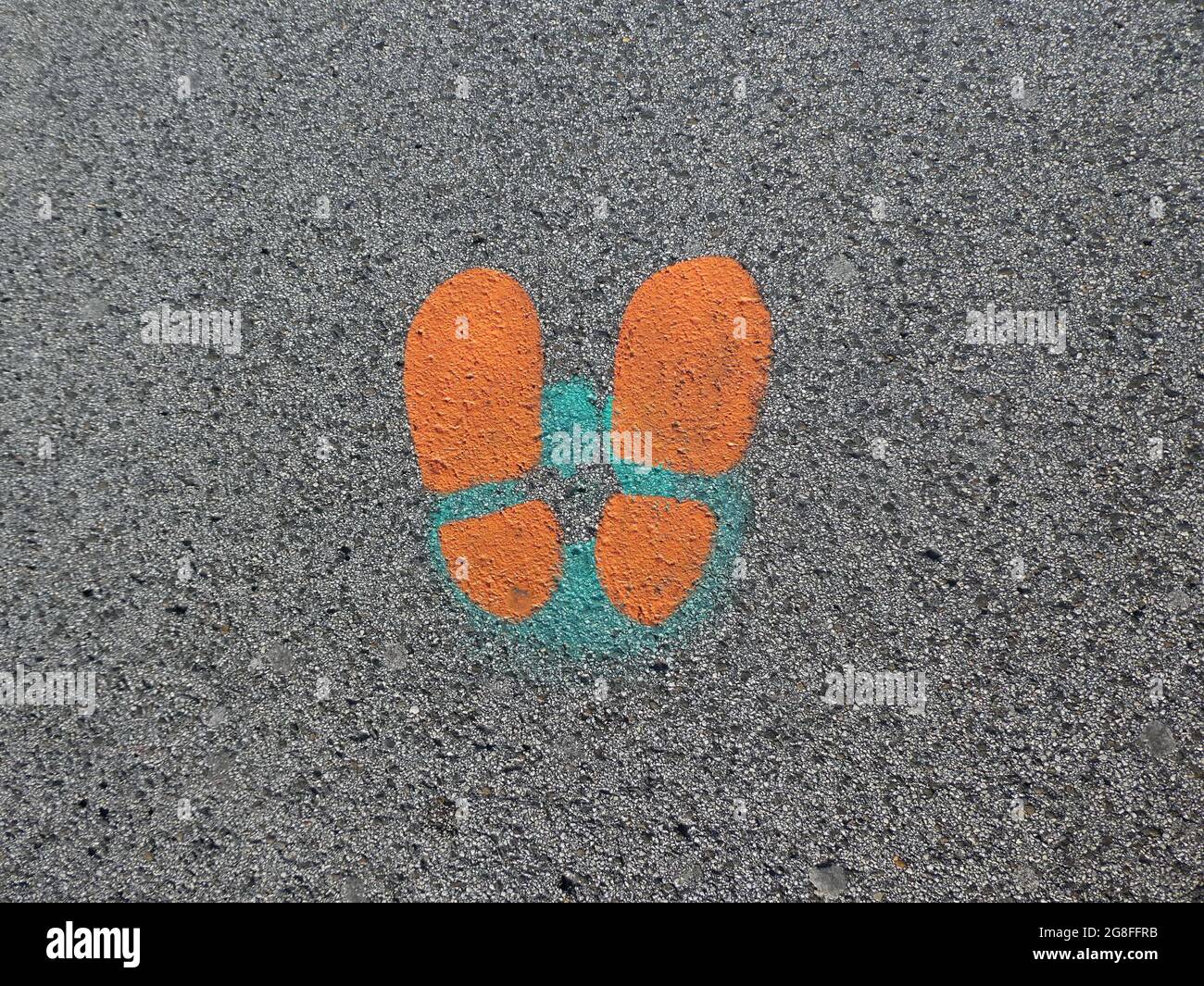 Orange footprint of shoes on the asphalt Stock Photo - Alamy