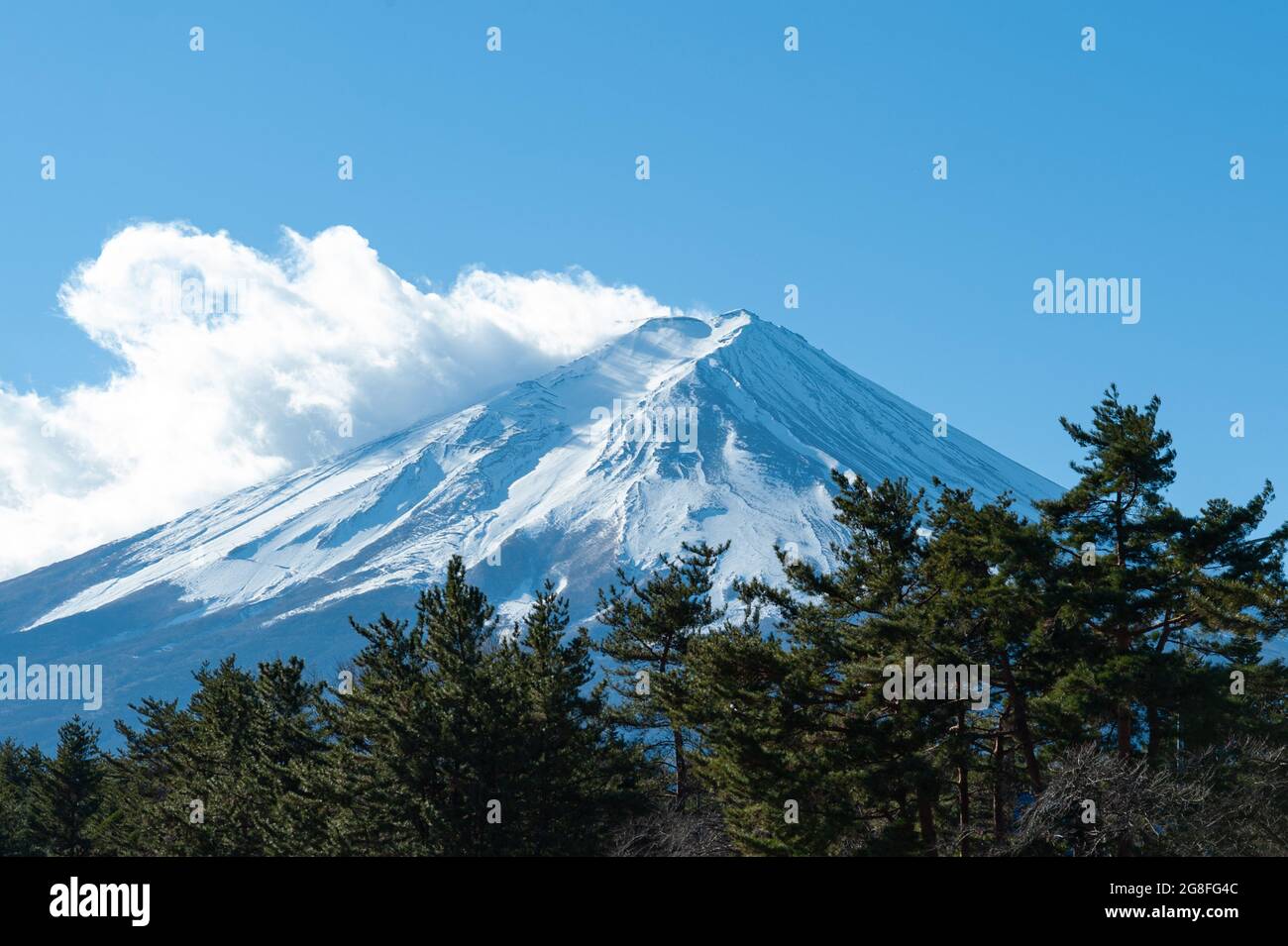Mount Fuji in winter covered with snow with beautiful blue sky and ...
