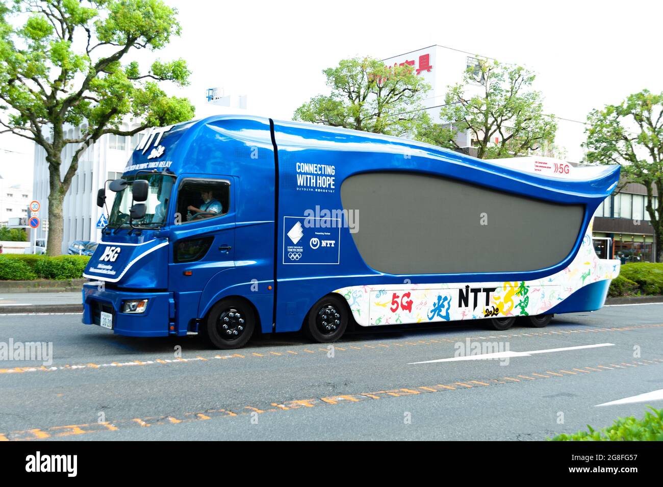 Tokyo 2020 Olympic Torch Relay. Car parade with partners and sponsors ...