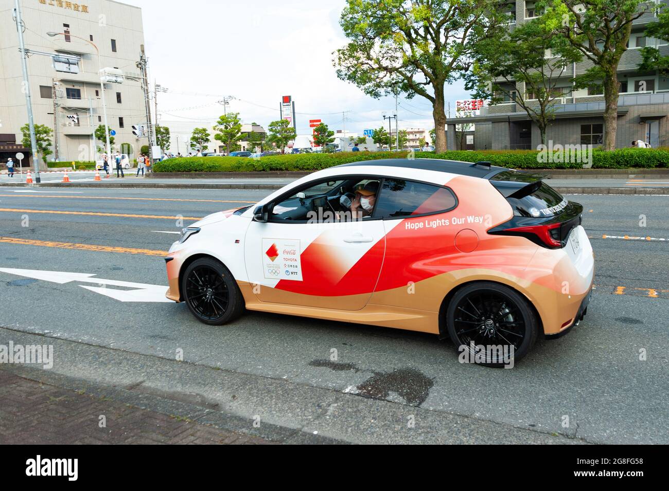 Tokyo 2020 Olympic Torch Relay. Car parade with partners and sponsors ...
