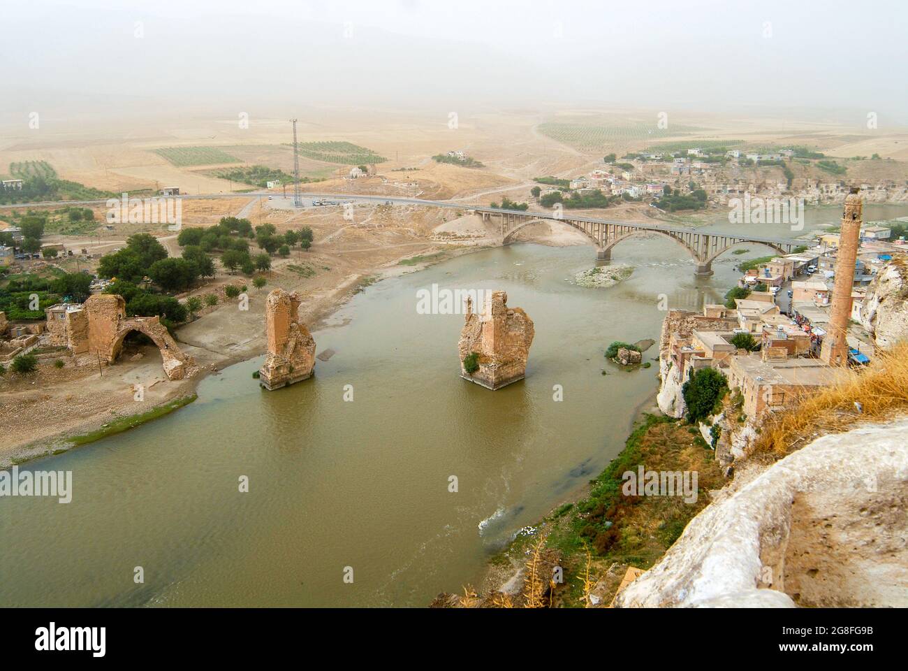 View of the ancient city of Hasankeyf and the historical bridge on the ...