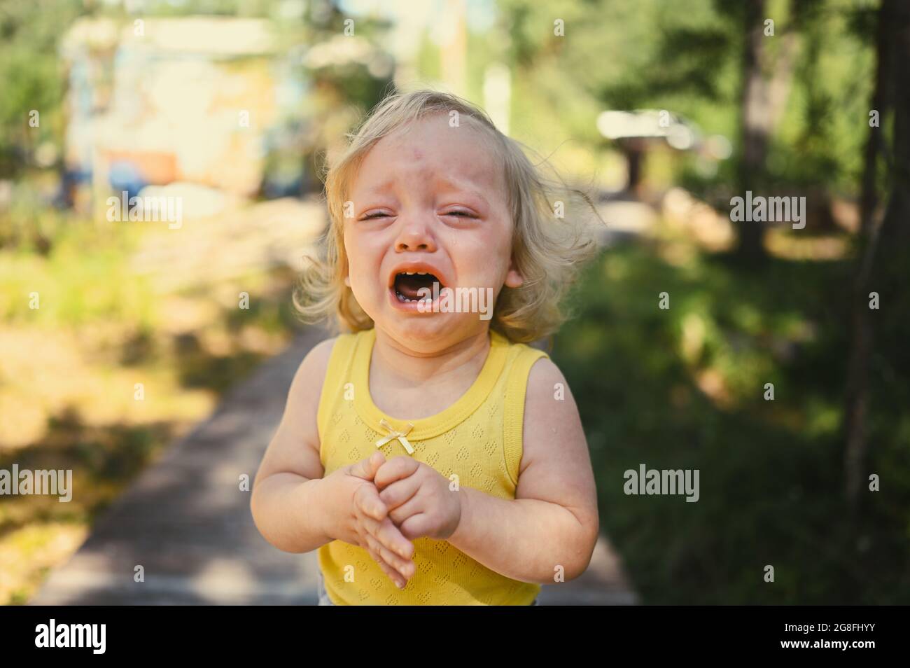 Close up portrait of little funny cute blonde girl child toddler in ...