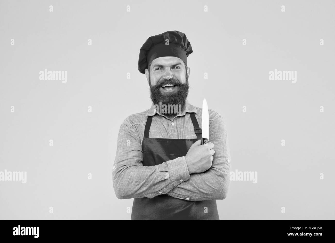 Chef using ceramic knife for cutting fruits and vegetables ...