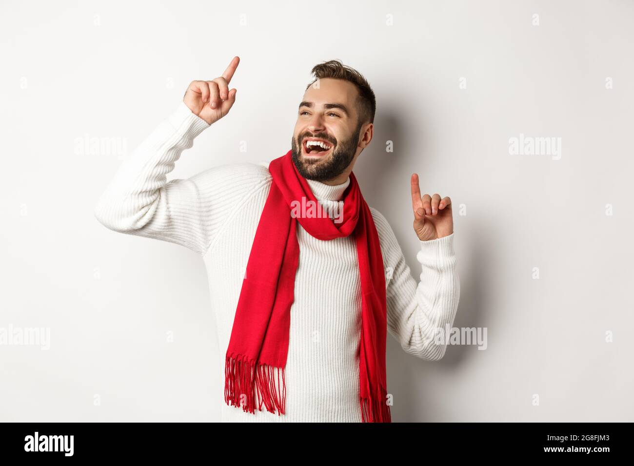 Happy man celebrating new year party, dancing and pointing fingers ...
