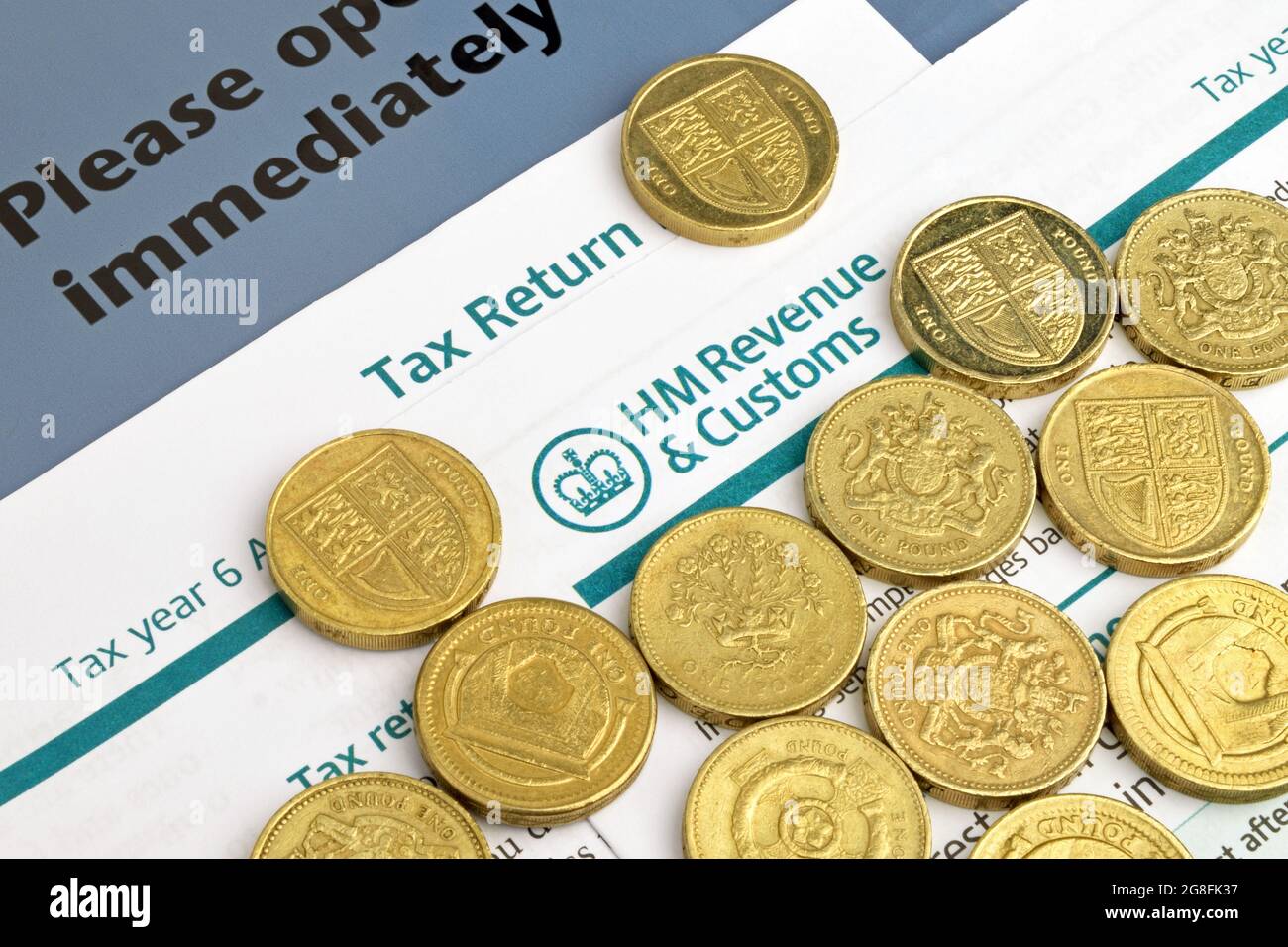 A close up of HM Revenue paper tax return with coins on top of it Stock ...