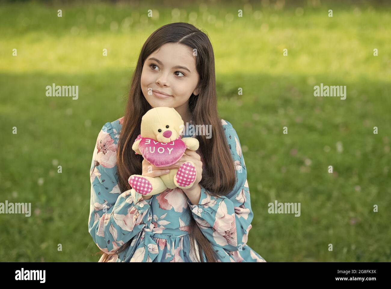 Girl kid hug soft toy teddy bear love symbol, valentines day concept ...