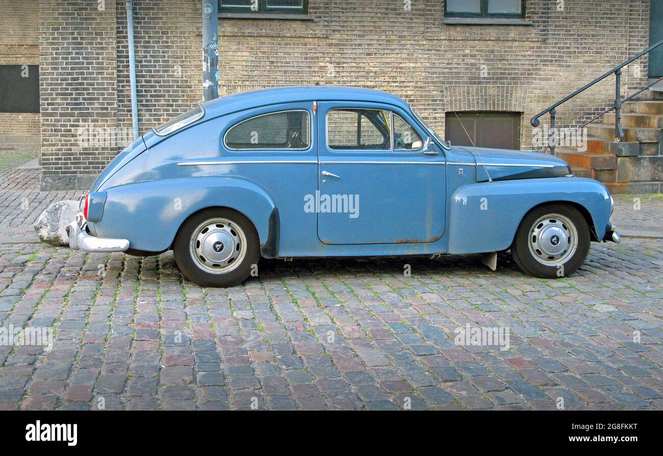 A vintage blue Volvo PV544 parked on a cobbled street Stock Photo - Alamy