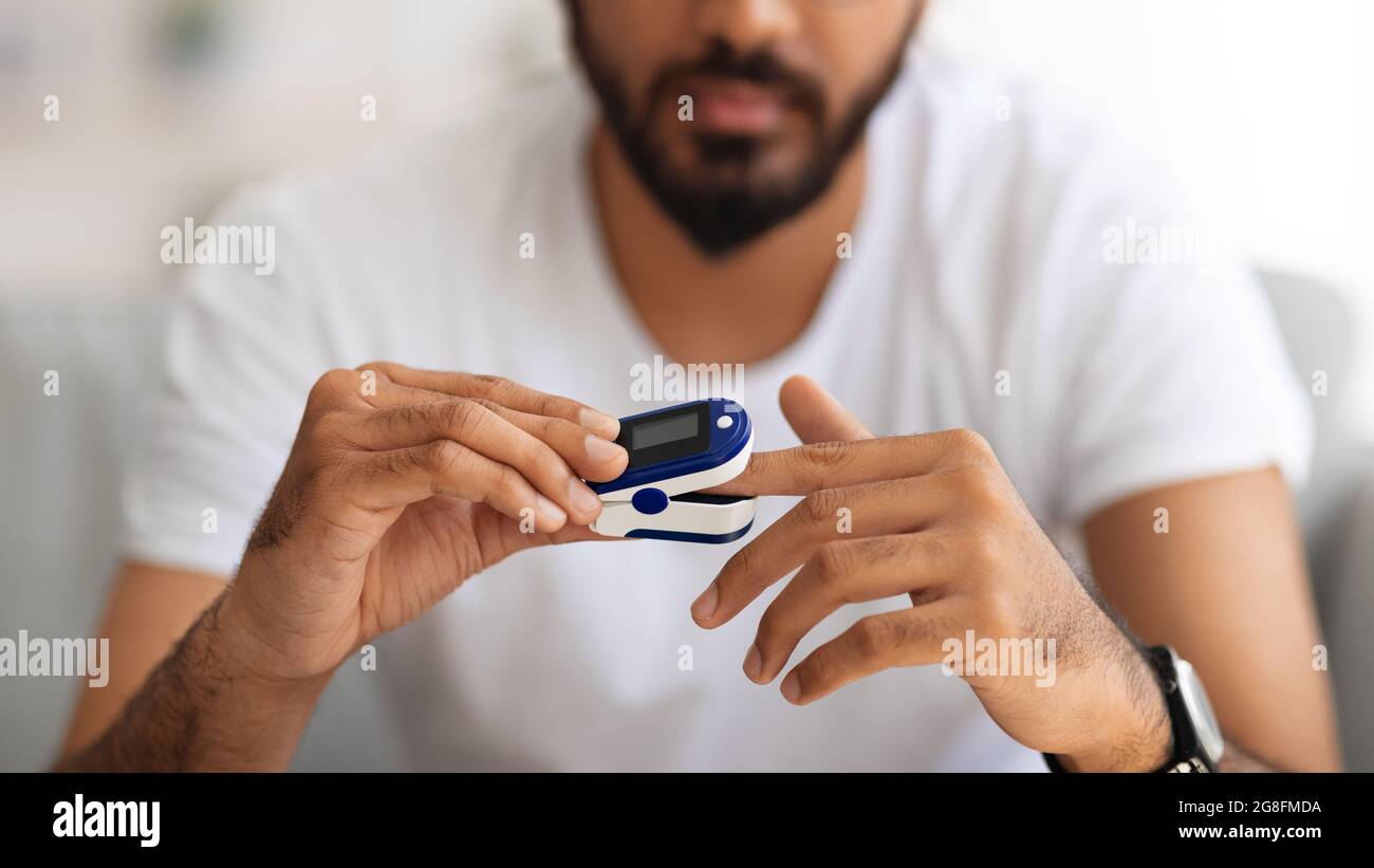 Pulse oximeter device measuring blood hi-res stock photography and ...