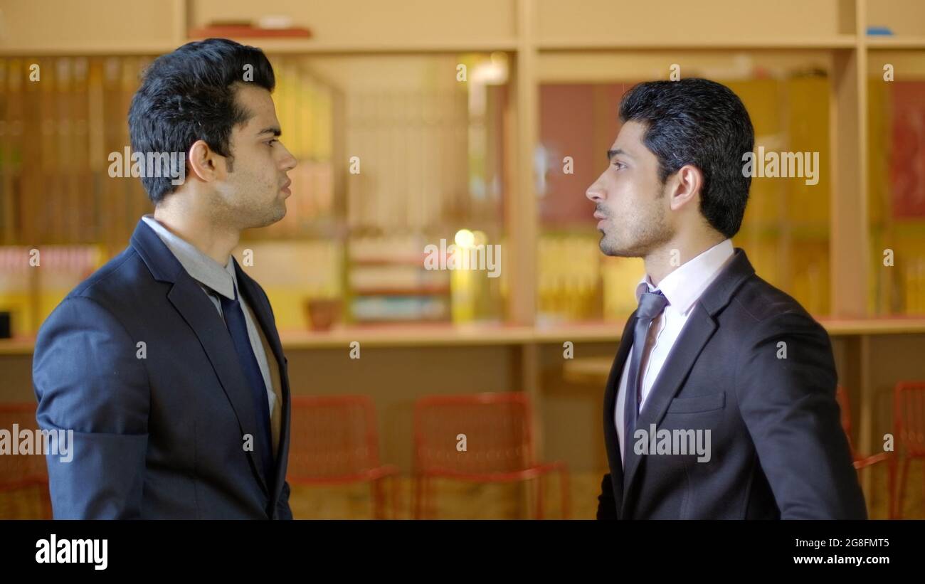 Indian colleagues discussing their work Stock Photo - Alamy