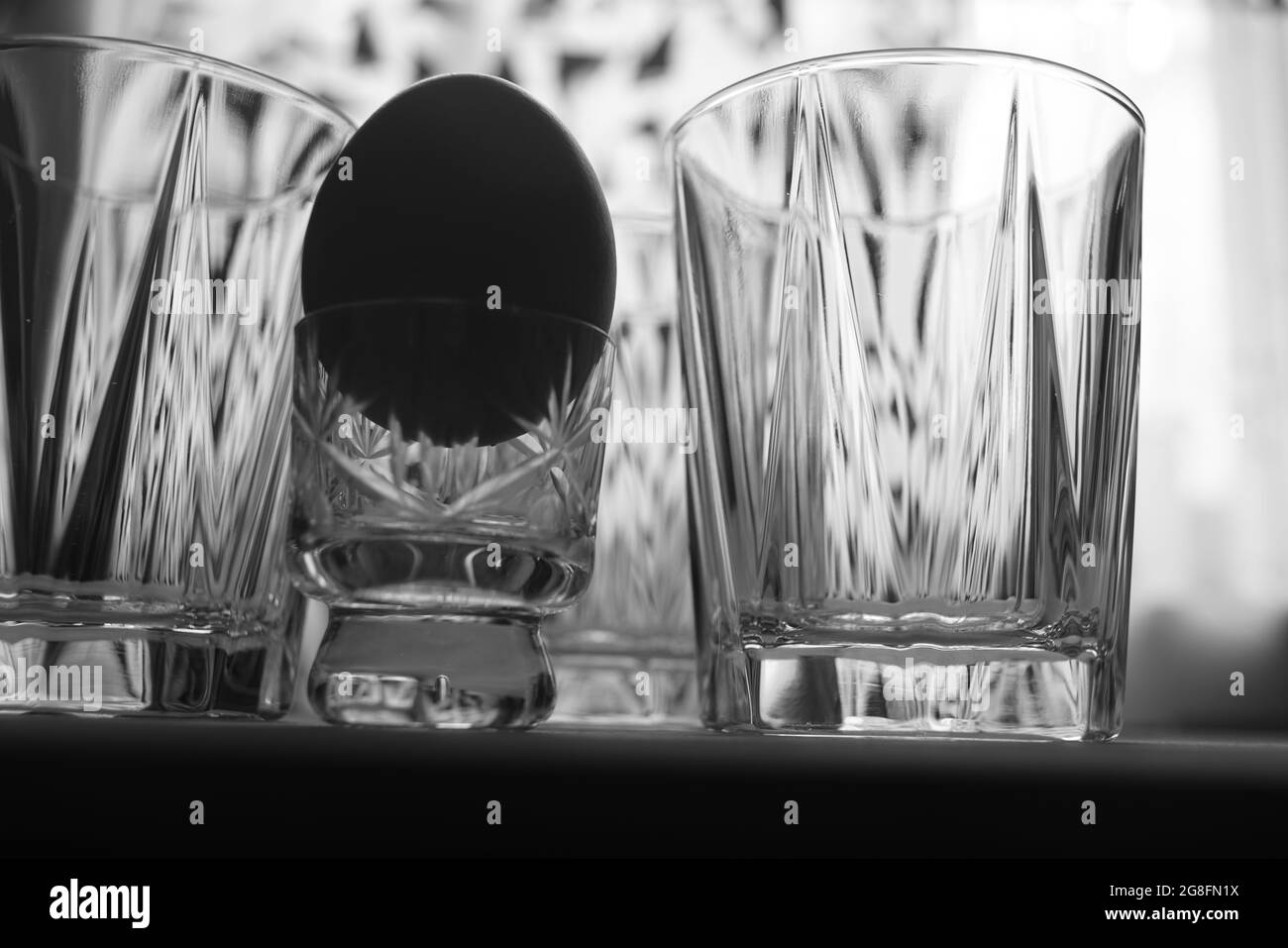 Egg and glass as fragile, wet, hard and strong elements of a household ...