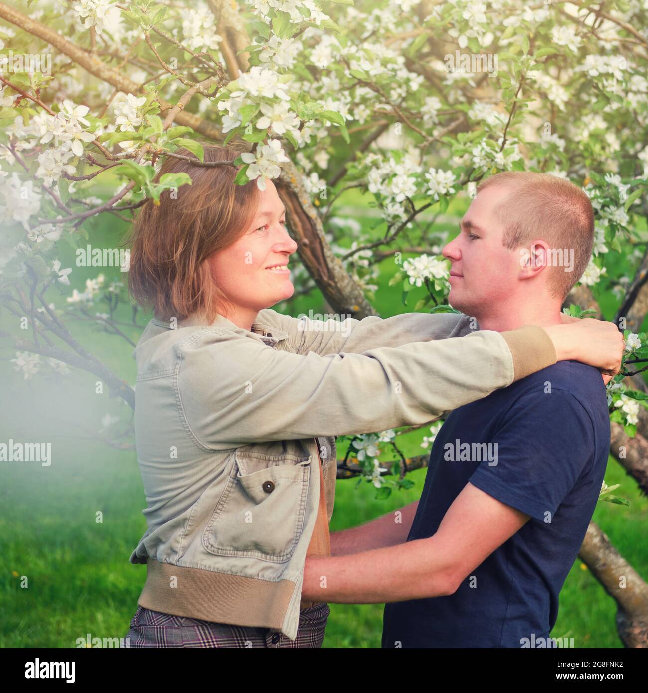 A couple of different ages on a date in a romantic park in nature Stock ...