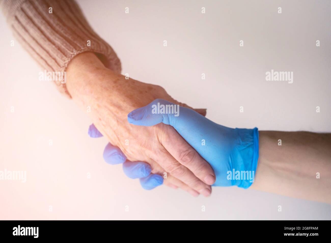 Woman handshake glove hi-res stock photography and images - Alamy