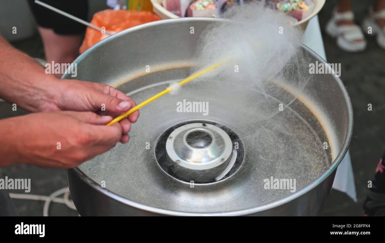 The process of making cotton candy on the street Stock Photo - Alamy The process of making cotton candy on the street Stock Photo - Alamy