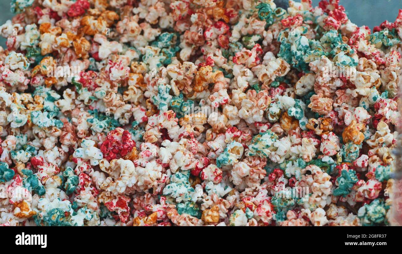 colored popcorn on white background Stock Photo - Alamy